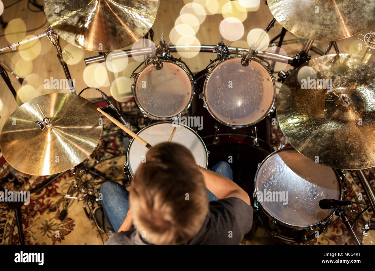 musician or drummer playing drum kit at studio Stock Photo - Alamy