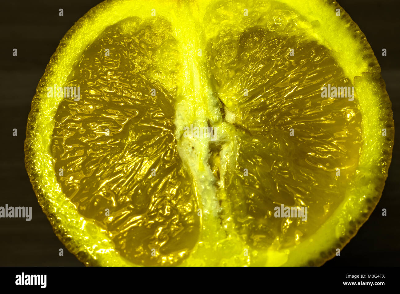 closeup of an expiring slice of an orange with dark background Stock ...