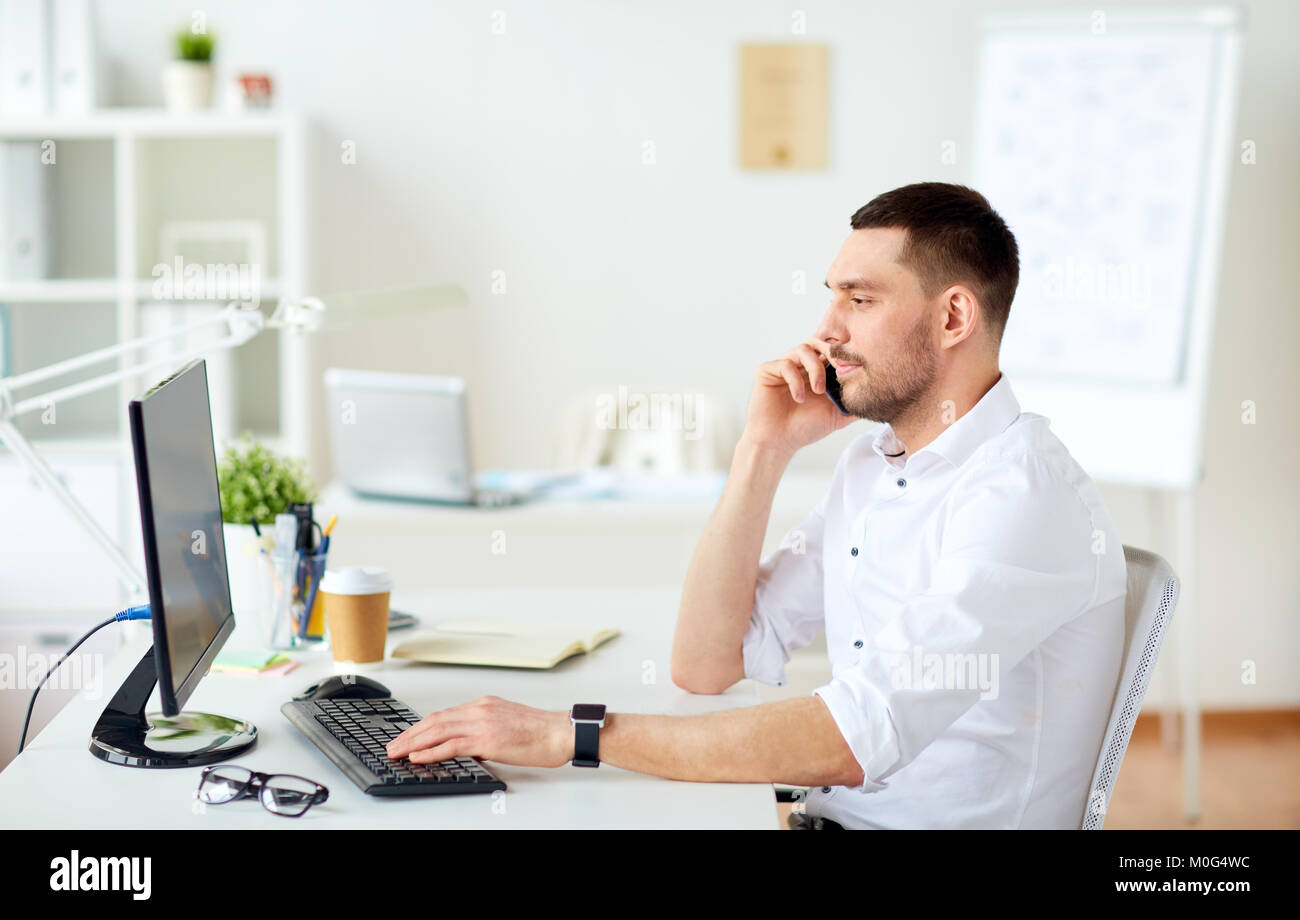 businessman calling on smartphone at office Stock Photo - Alamy