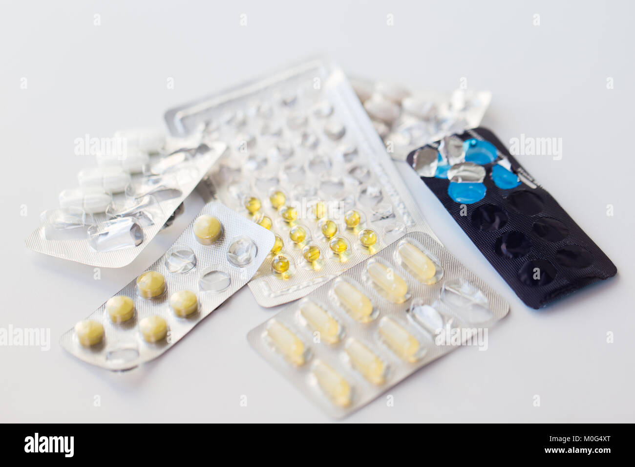 old open packs with pills and capsules of drugs Stock Photo - Alamy