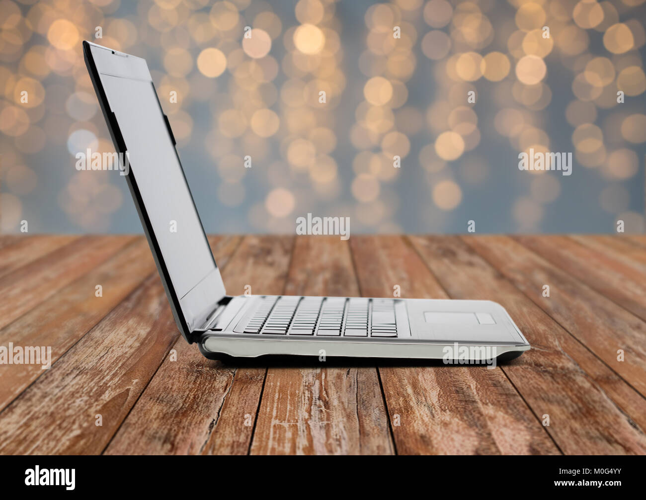 laptop computer over lights Stock Photo - Alamy