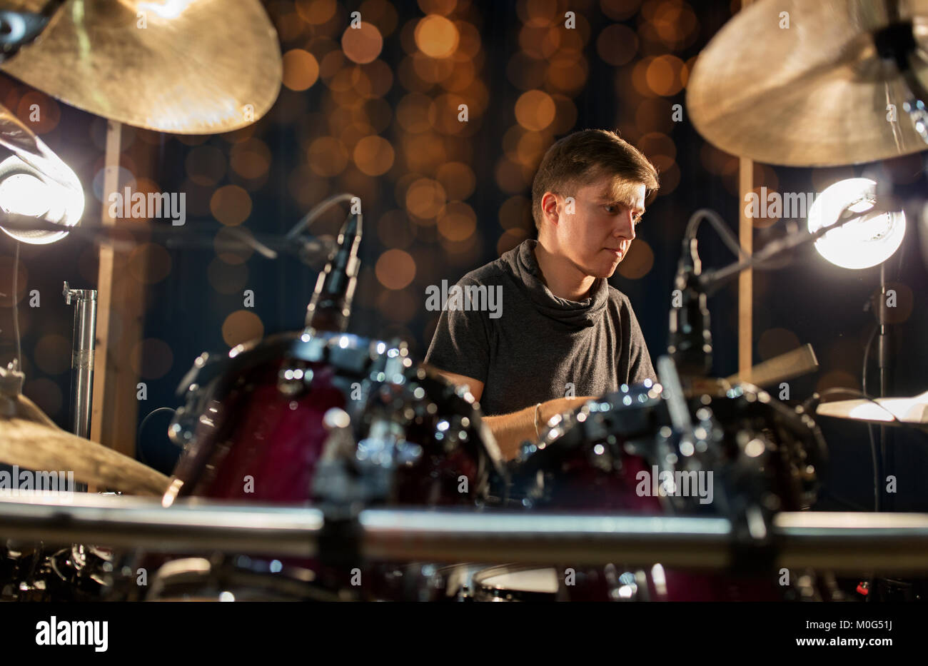 male musician playing drum kit at concert Stock Photo - Alamy