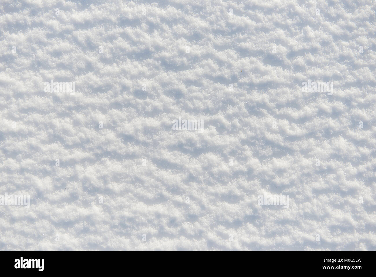 snow for texture or background at sunny day, bright light with shadows ...
