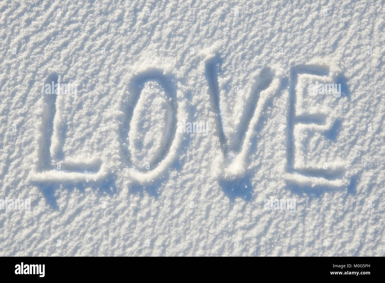 Love text written on snow for texture or background - winter holiday ...