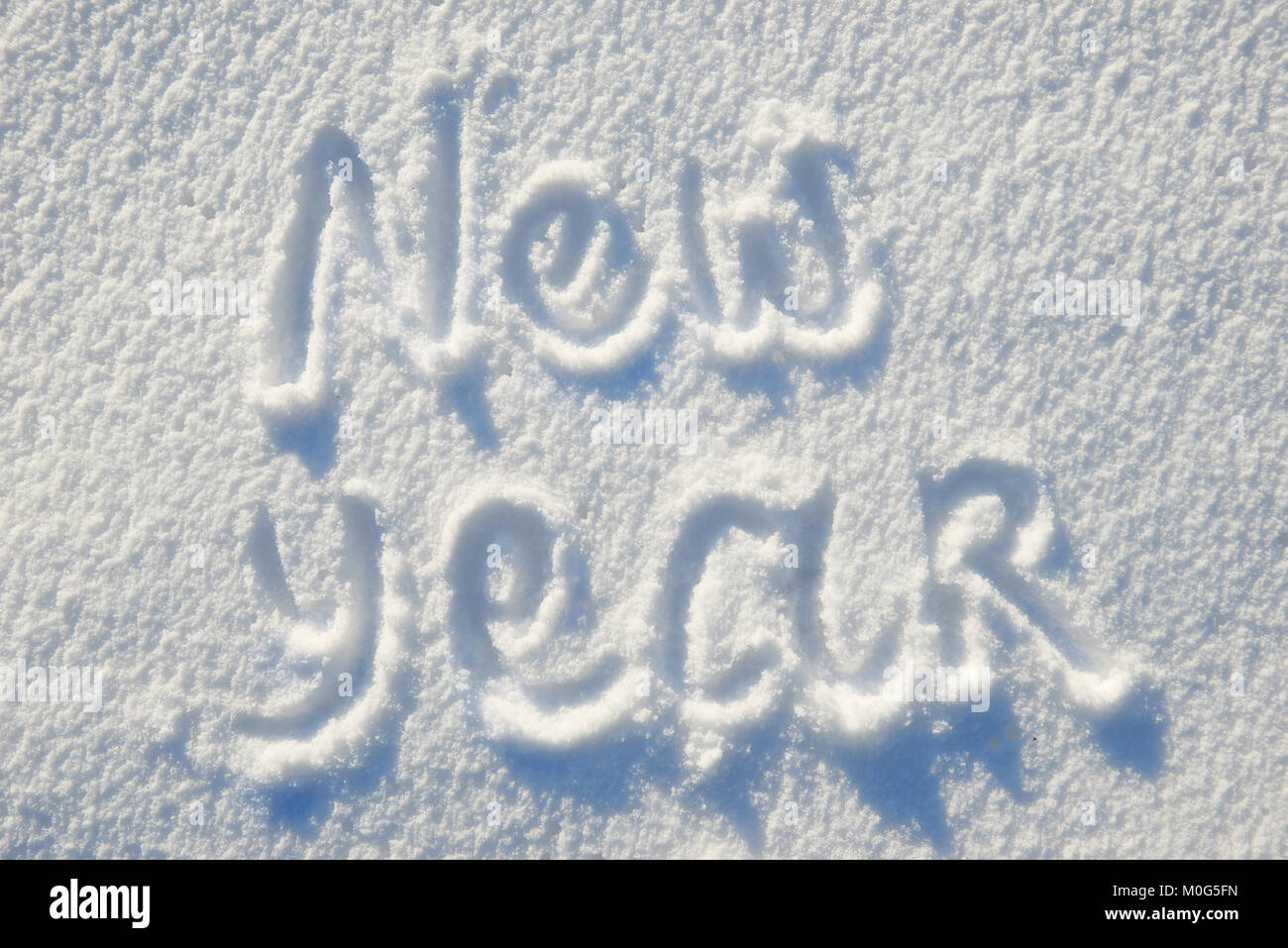 New year text written on snow for texture or background - winter ...