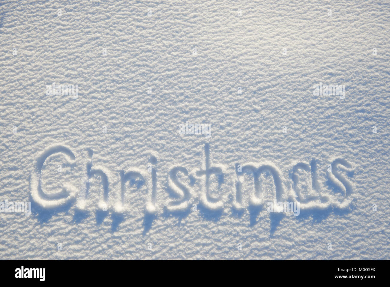 Christmas text written on snow for texture or background - winter ...