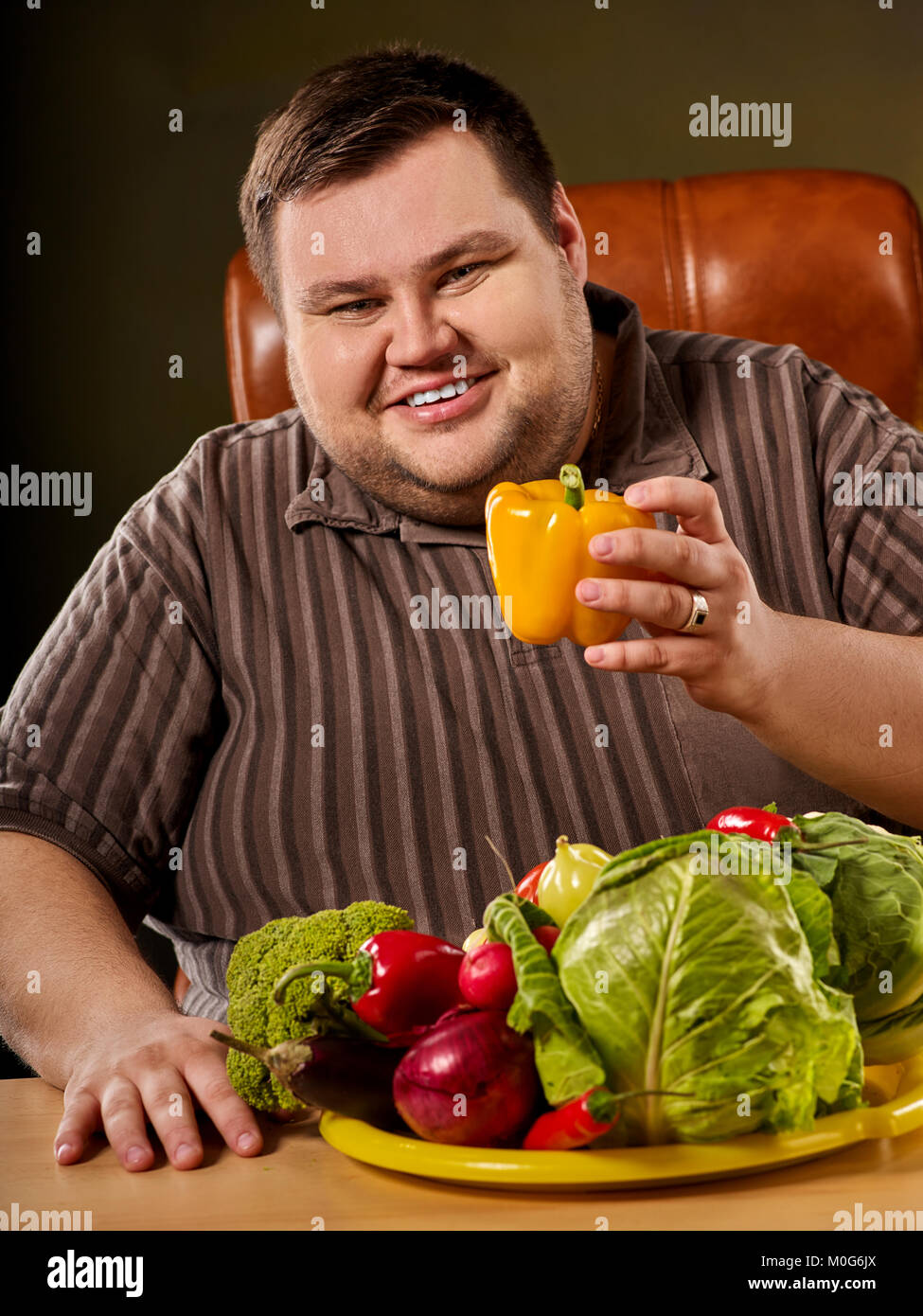 Diet fat man eating healthy food. Healthy breakfast vegetables ...
