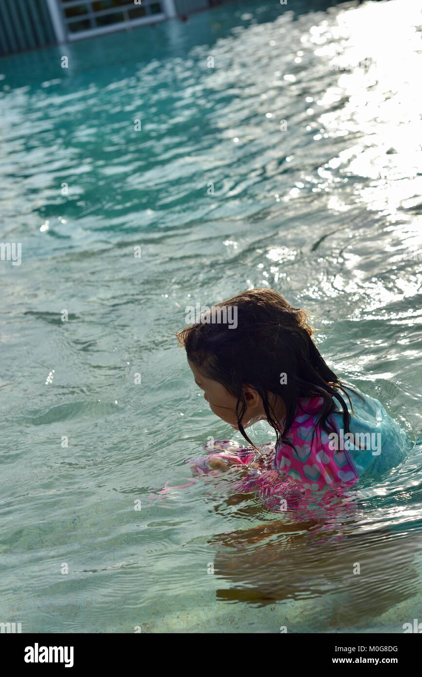 Girl baths in Riverway pool, Townsville, Queensland, Australia Stock ...