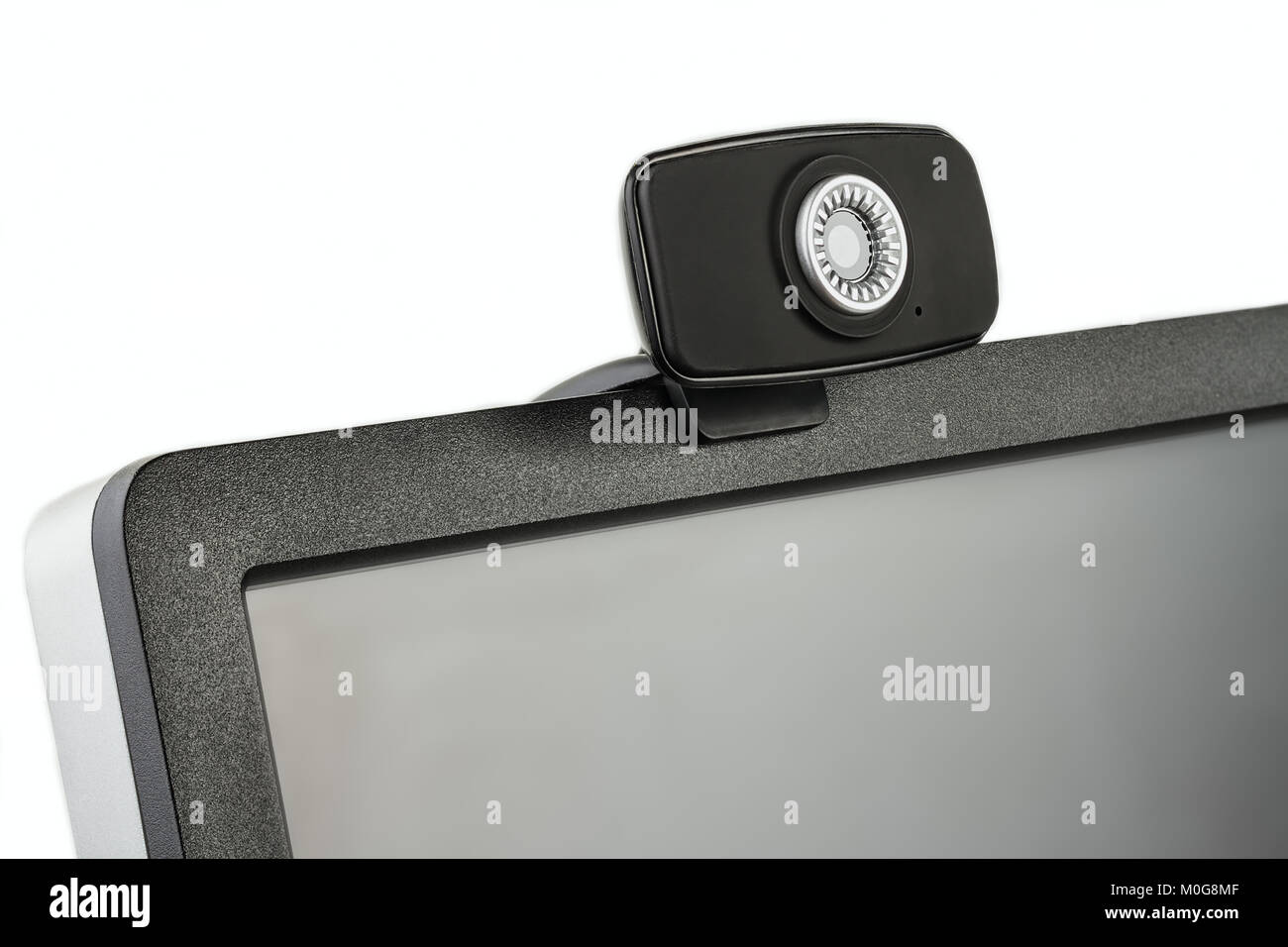 Digital black computer monitor screen and HD web camera on white ...