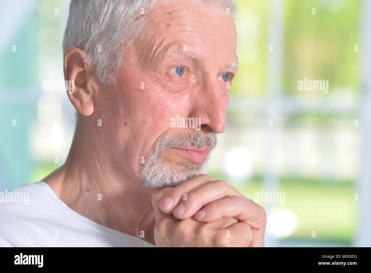 Sad senior man at home Stock Photo - Alamy