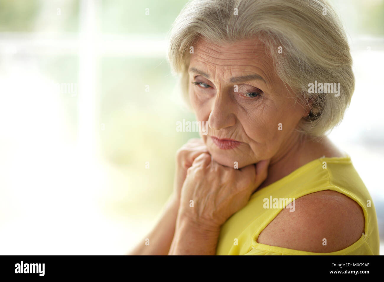 stressed senior woman Stock Photo - Alamy