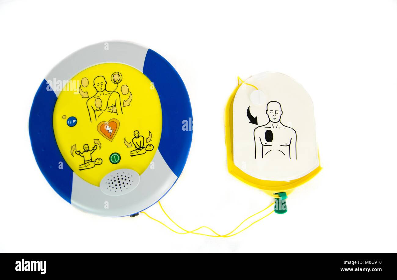 An automated external defibrillator or AED with pads isolated on white ...