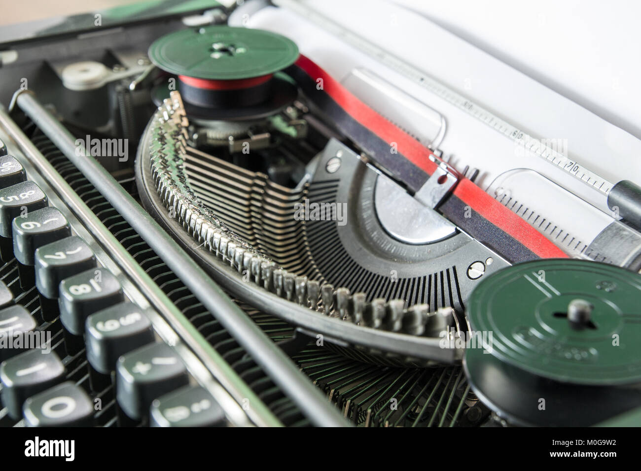 Detail of an old retro typewriter and blank paper Stock Photo - Alamy