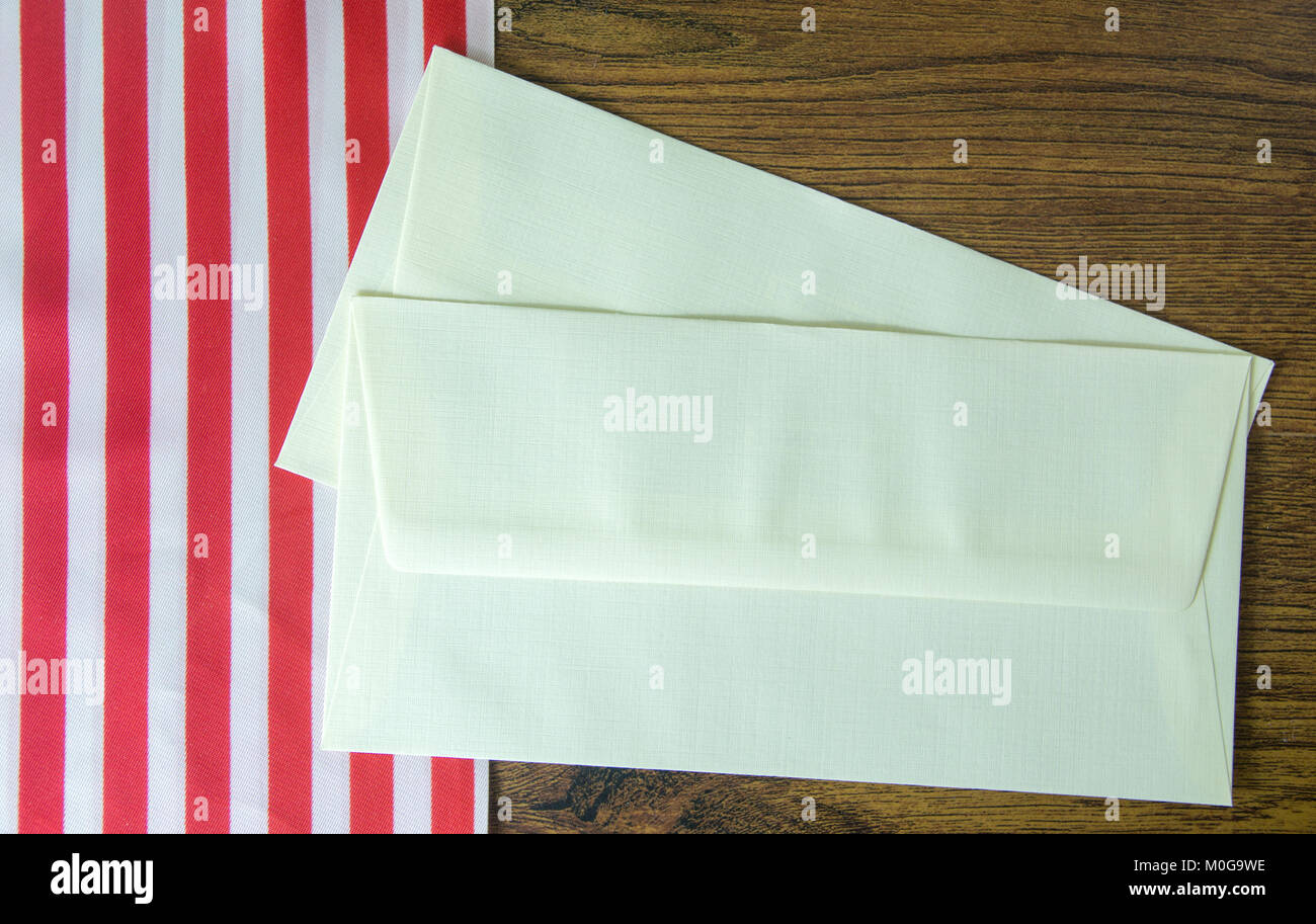 Two blank envelopes on wood table Stock Photo - Alamy