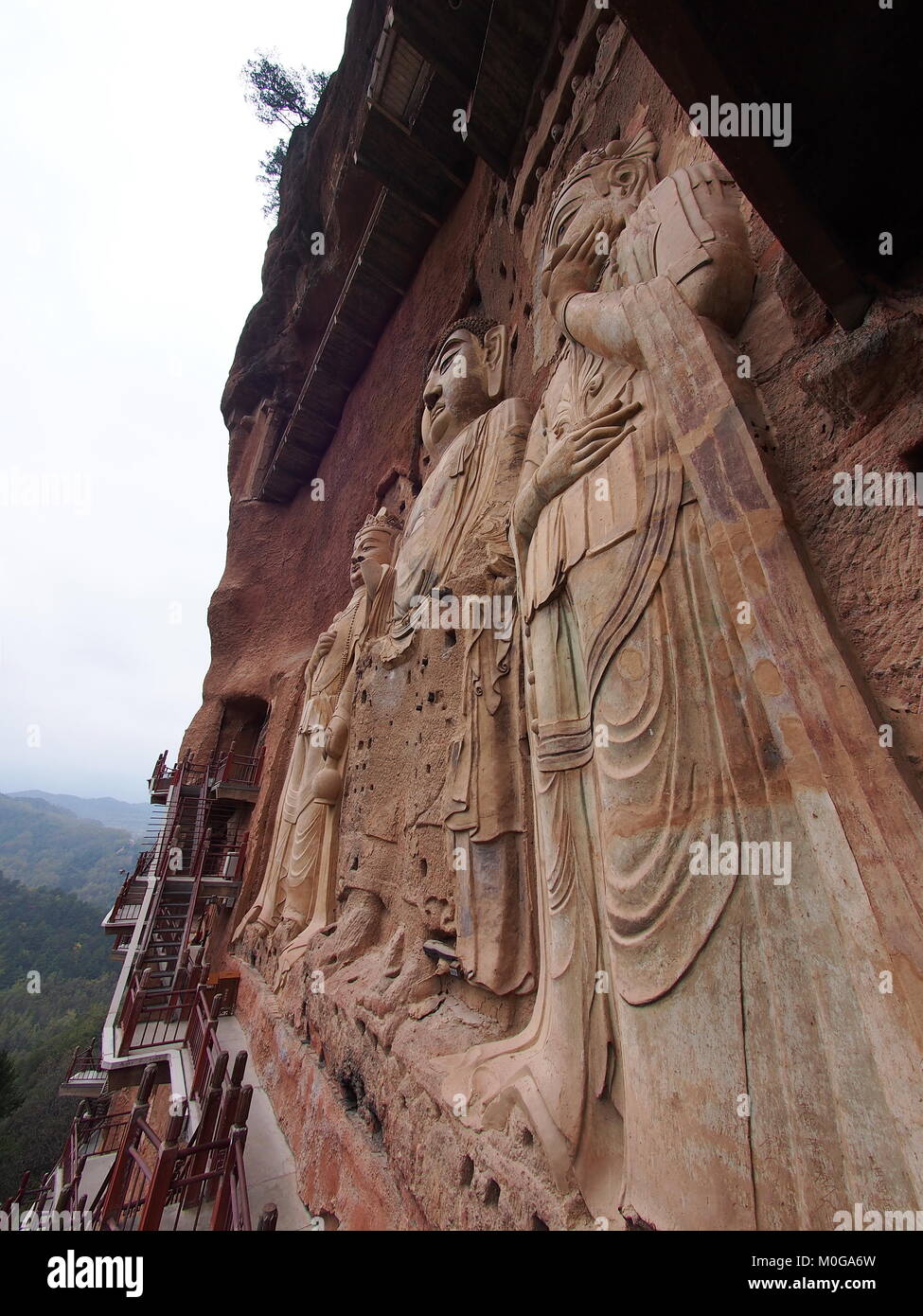 Maiji Shan Stone Mountain with ancient buddhist carving statue. Travel ...