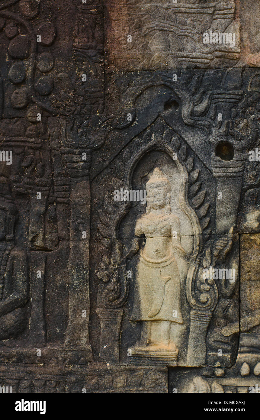 Bas relief symbols carved on stone walls in Ankor, Siem Reap Stock ...