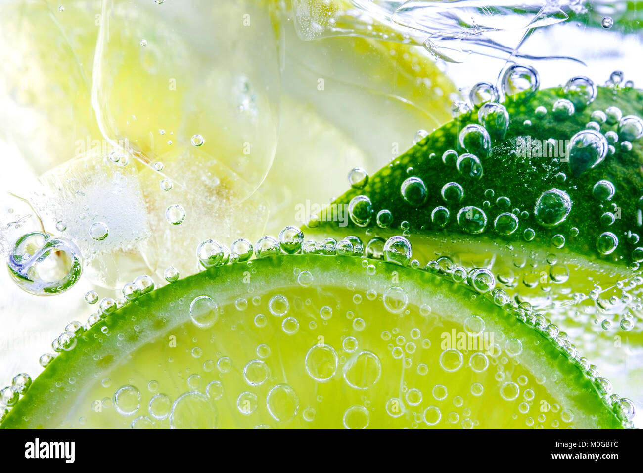 Lemon drop in fizzy sparkling water, juice refreshment Stock Photo - Alamy