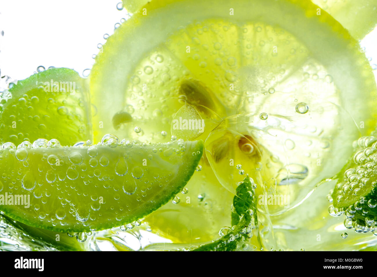 Lemon drop in fizzy sparkling water, juice refreshment Stock Photo - Alamy