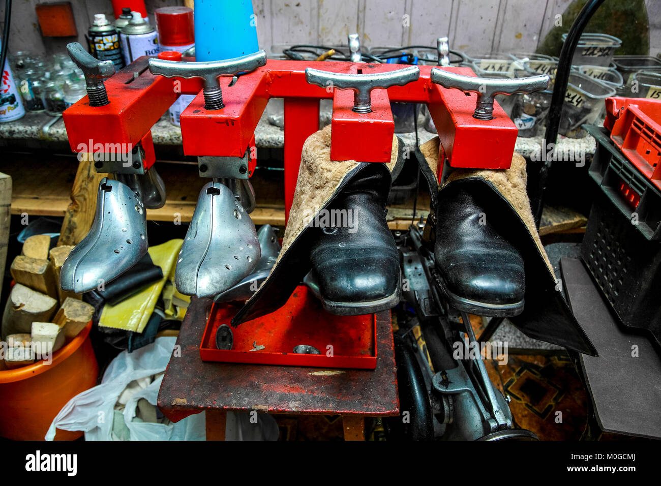 Workshop for repair of footwear. Machines for stretching of shoes. They ...