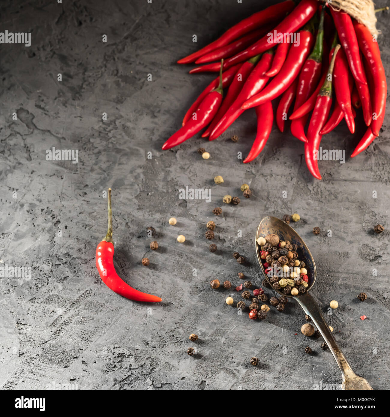 Red hot chilli pepper paprika in and peppers seed ball on stone table ...