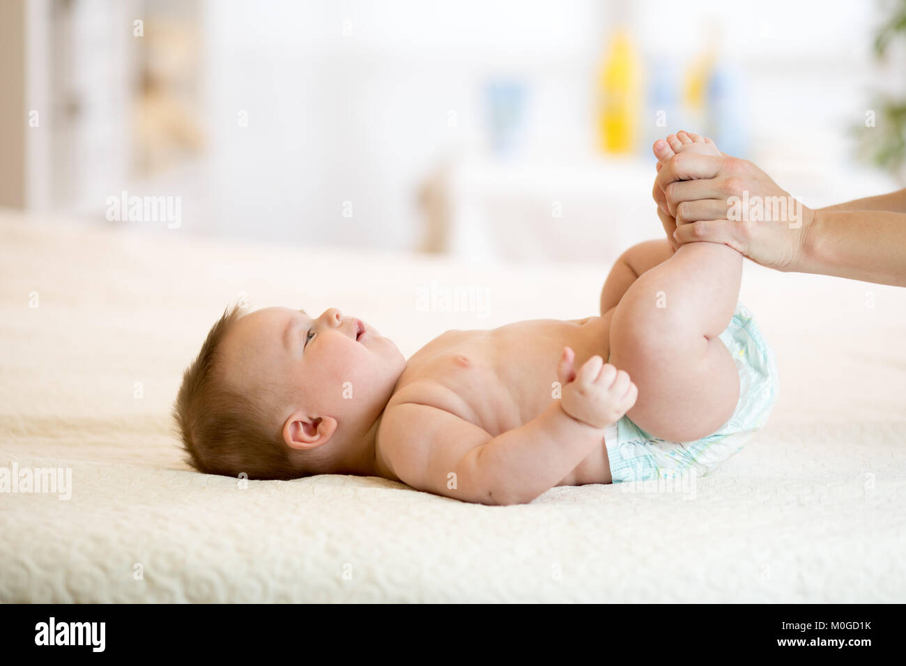 baby newborn is enjoying massage from mother Stock Photo - Alamy