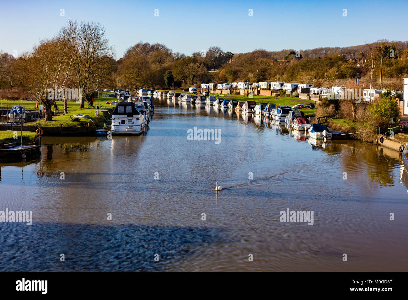 The River Medway at Wateringbury on a cold winters day, with boats and ...
