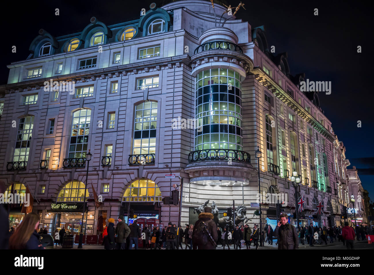 Building at the corner of Coventry Street and Haymarket at night with ...