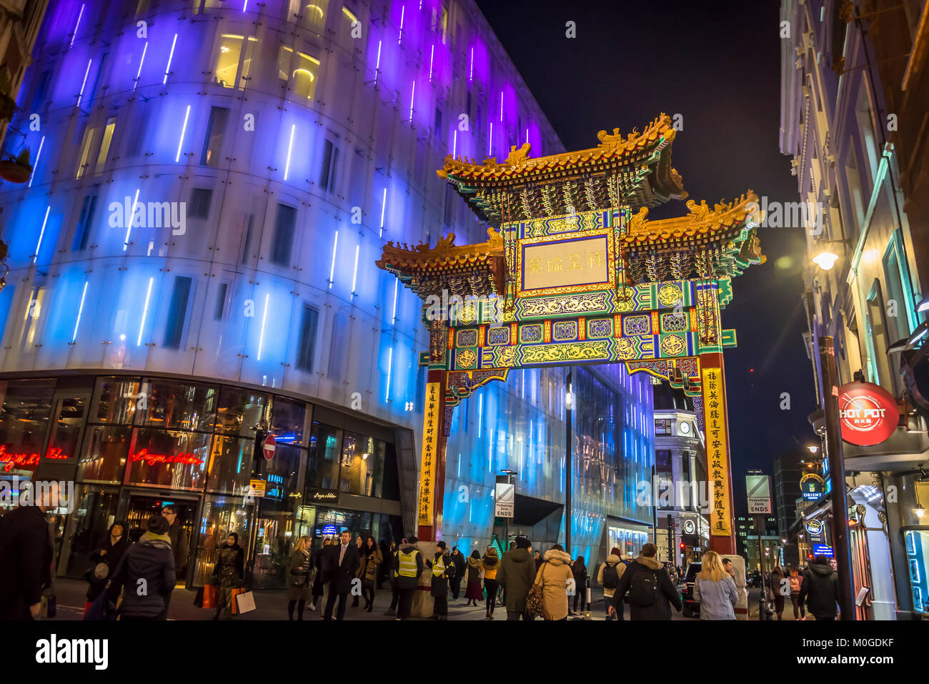 Chinese Arch in colourful Chinatown next to the modern architecture of ...