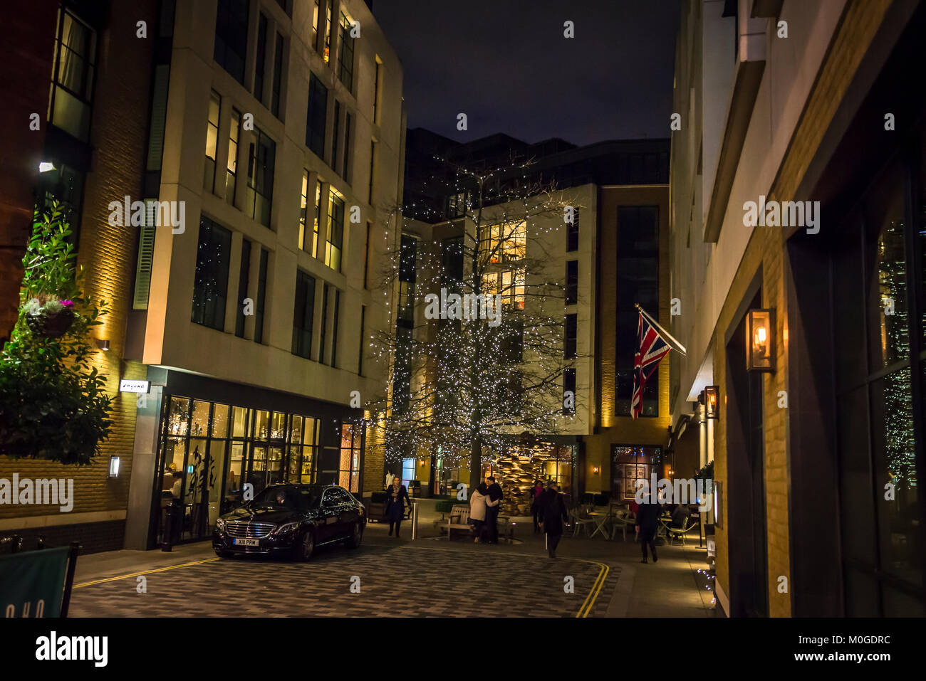 Posh Street in Soho with an illuminated tree, London, England, UK Stock ...