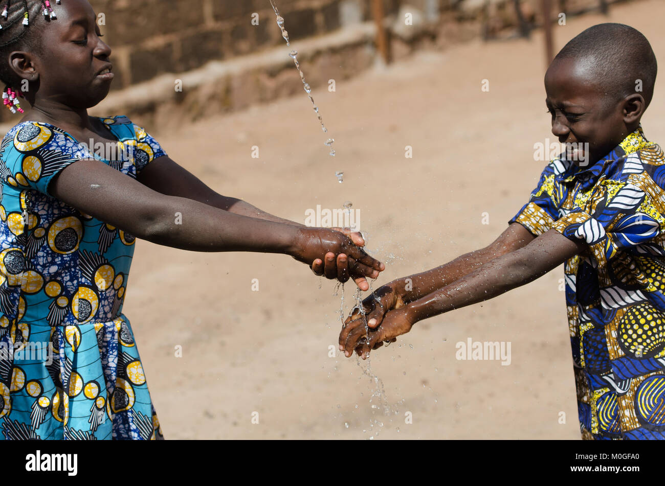 Helping kids in africa hi-res stock photography and images - Alamy
