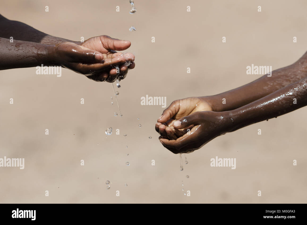 Child washing hands ethnic hi-res stock photography and images - Alamy