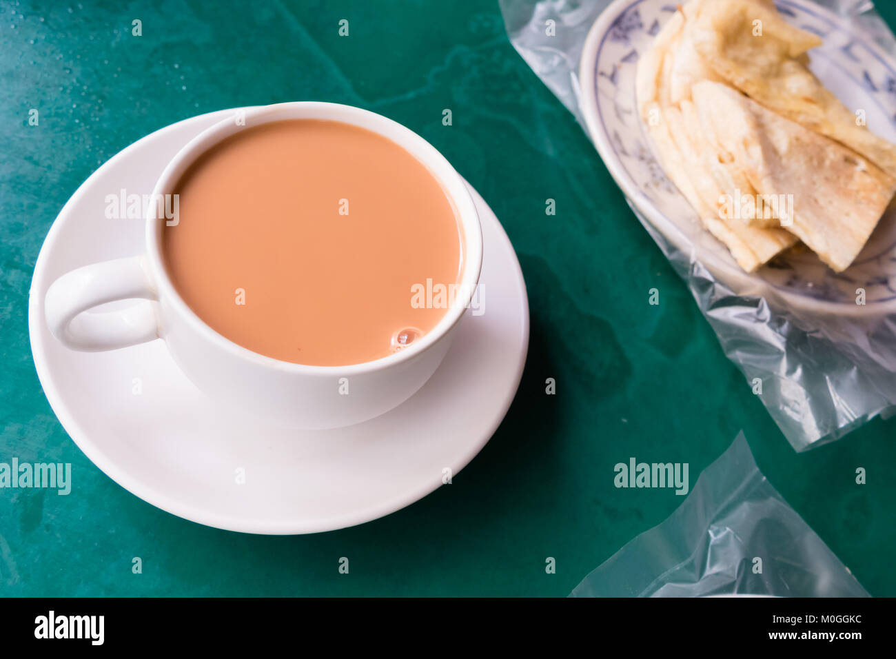 Burmese milk tea and sweet dessert na'an served on table Stock Photo ...