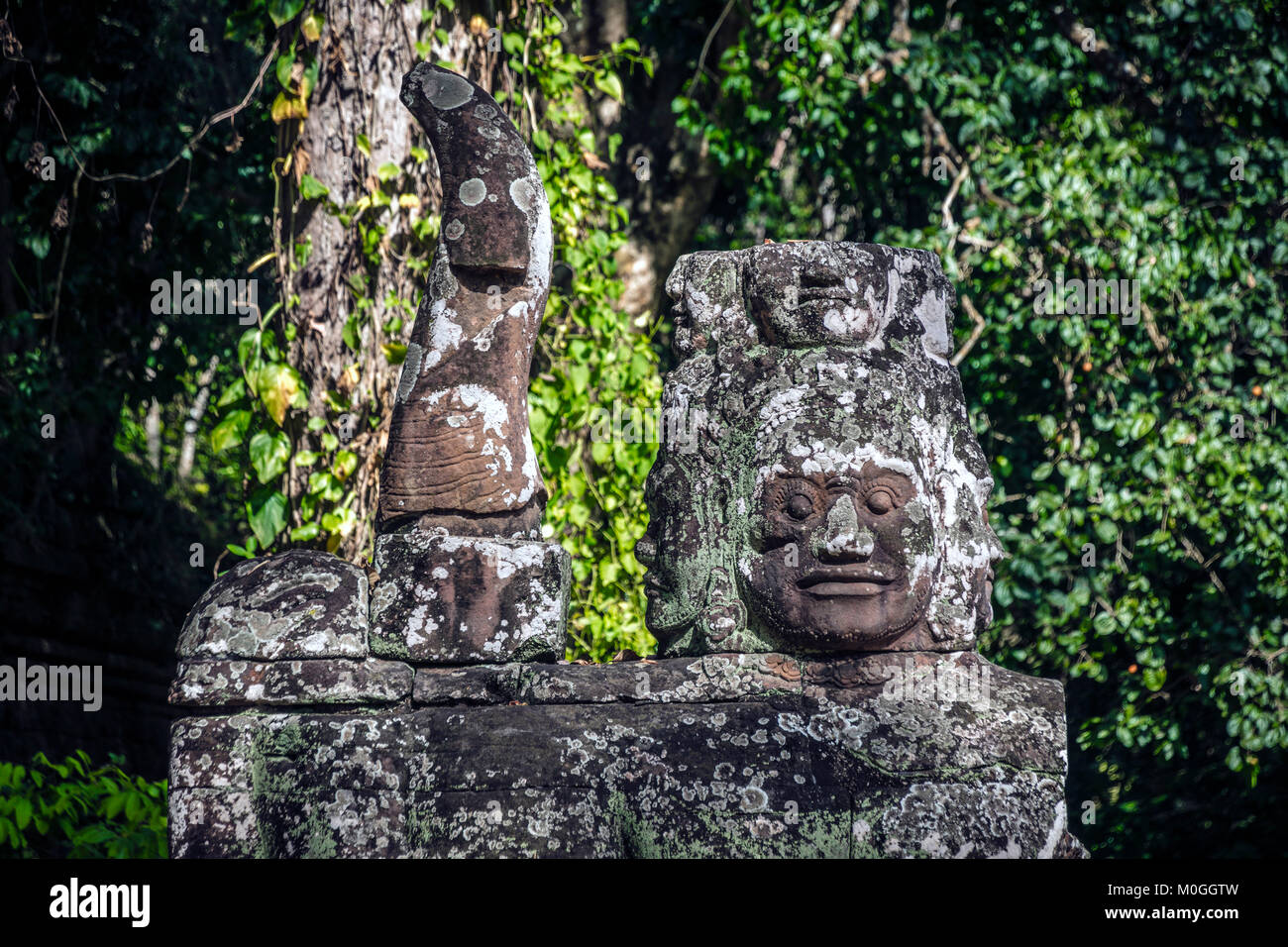 Statue on bridge at The Victory Gate, Bayon Temple, Angkor Thom ...