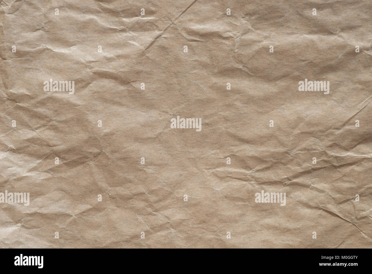 brown creased paper background texture closeup Stock Photo - Alamy