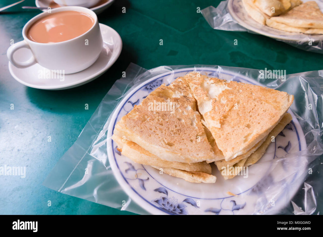 Burmese milk tea and sweet na'an served on table Stock Photo - Alamy