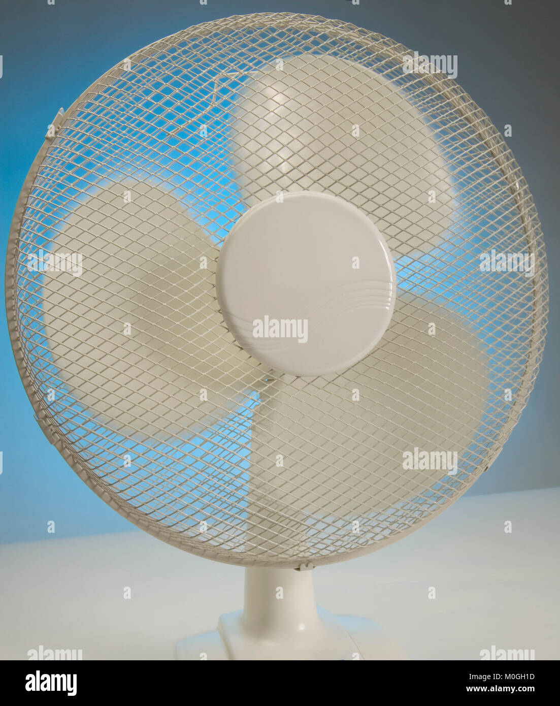 White desk fan studio still life Stock Photo - Alamy