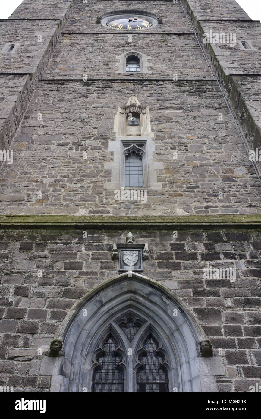 Detail of stone gothic church steeple with arched windows and round ...