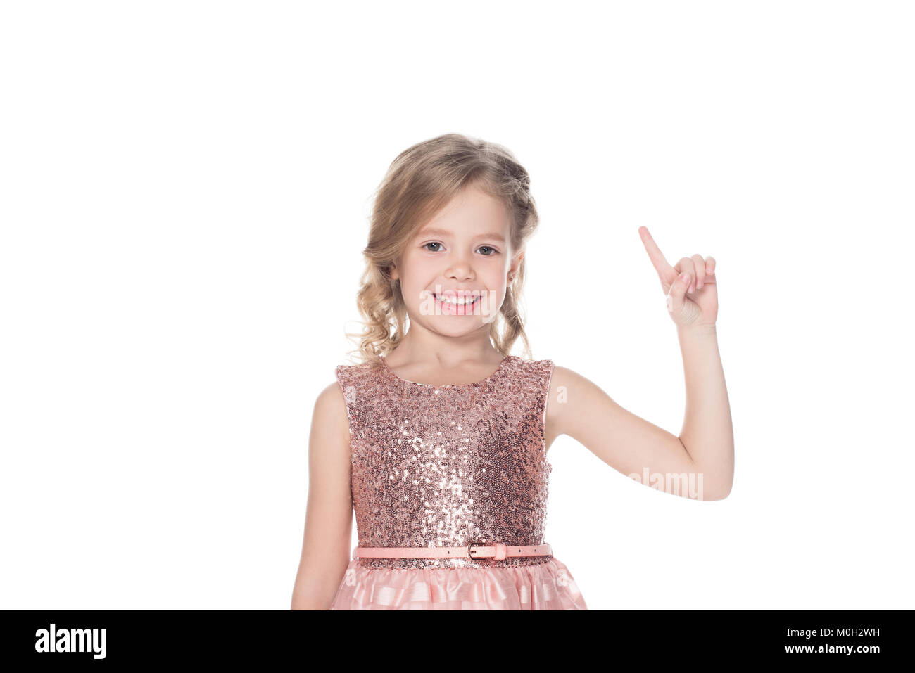 beautiful smiling child pointing up, isolated on white Stock Photo - Alamy