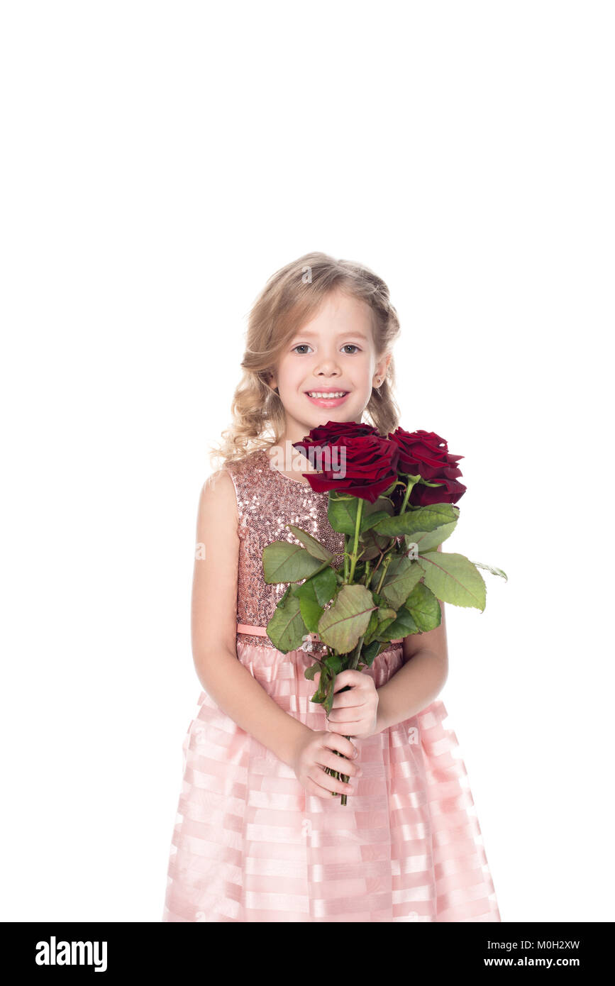 adorable child in dress holding bouquet of red roses, isolated on white ...