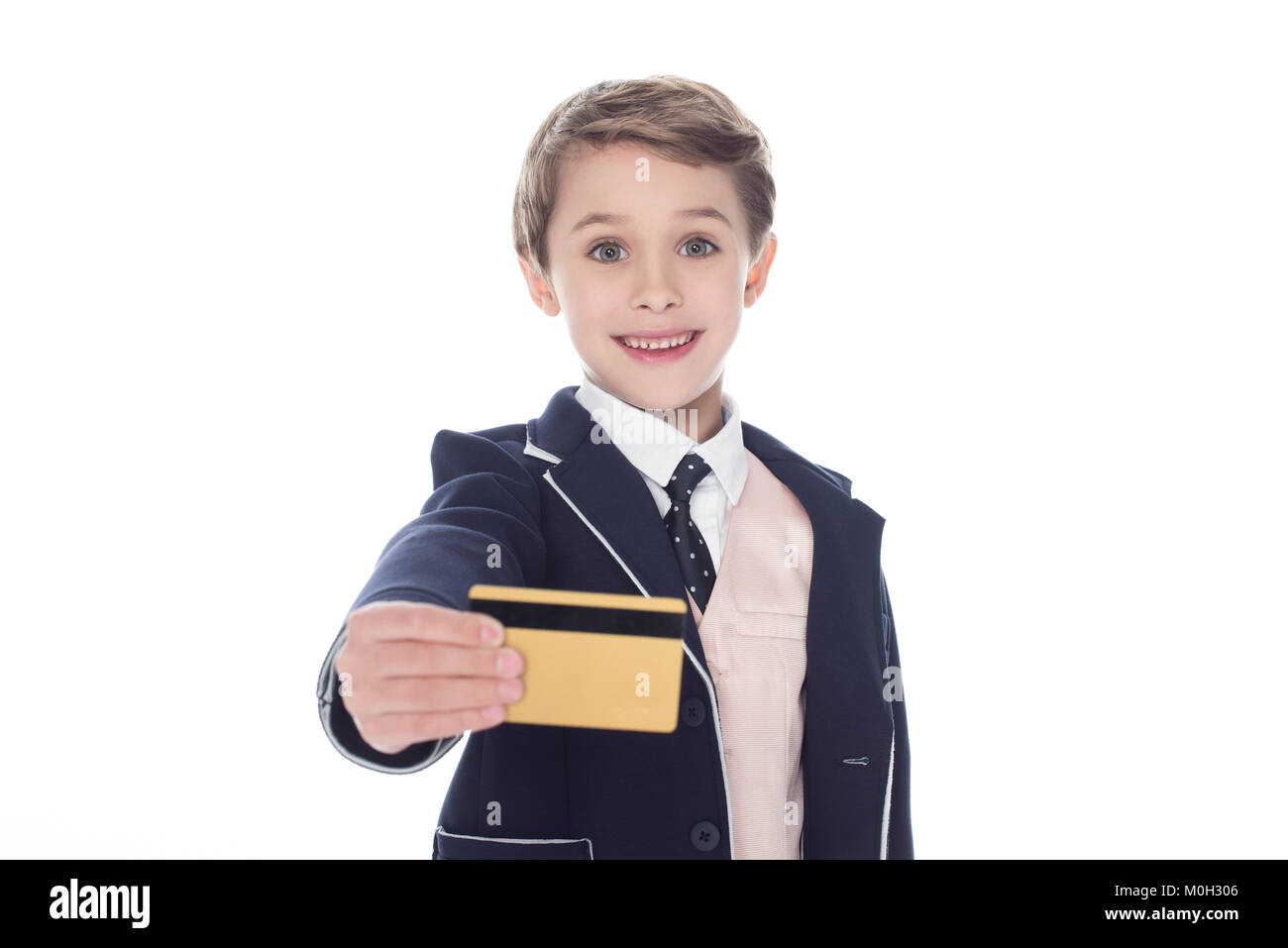 little boy holding golden credit card, isolated on white Stock Photo ...