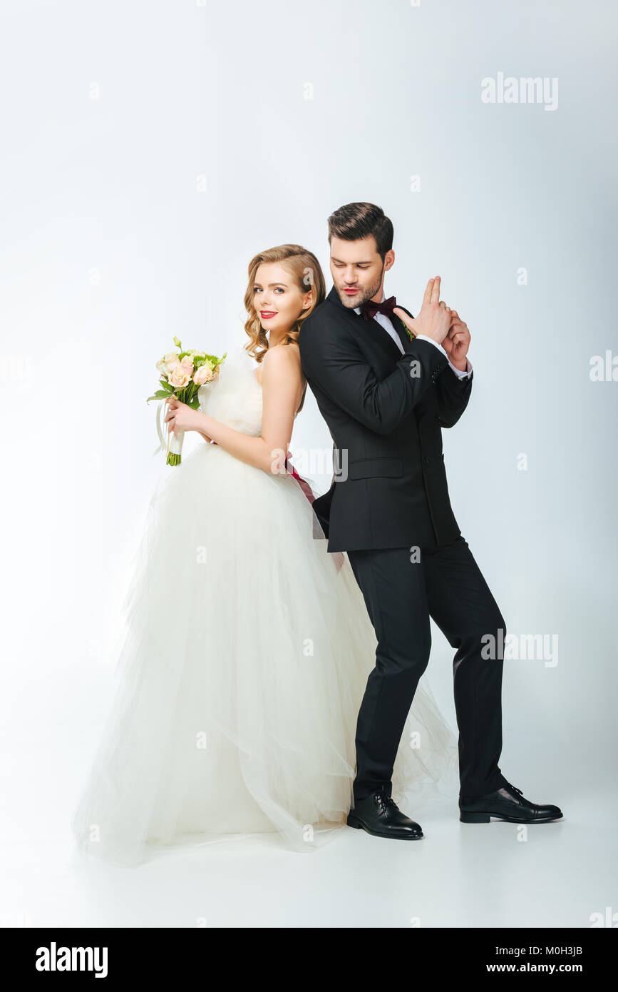 bride and groom standing back to back together Stock Photo - Alamy