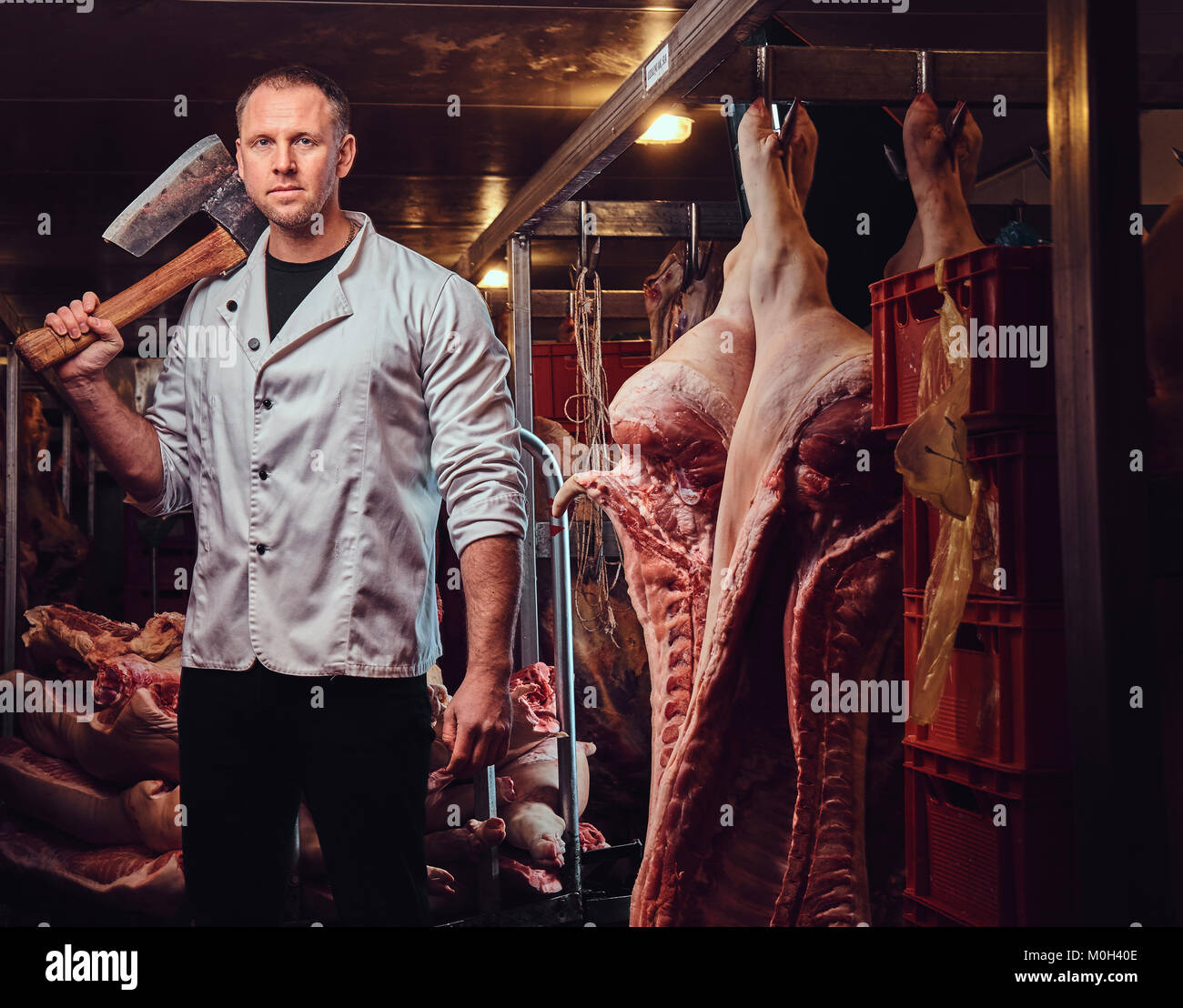 A butcher in a meat factory Stock Photo - Alamy