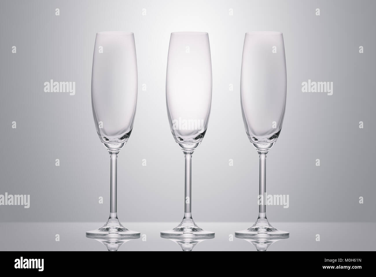 three empty clean glasses on white Stock Photo - Alamy