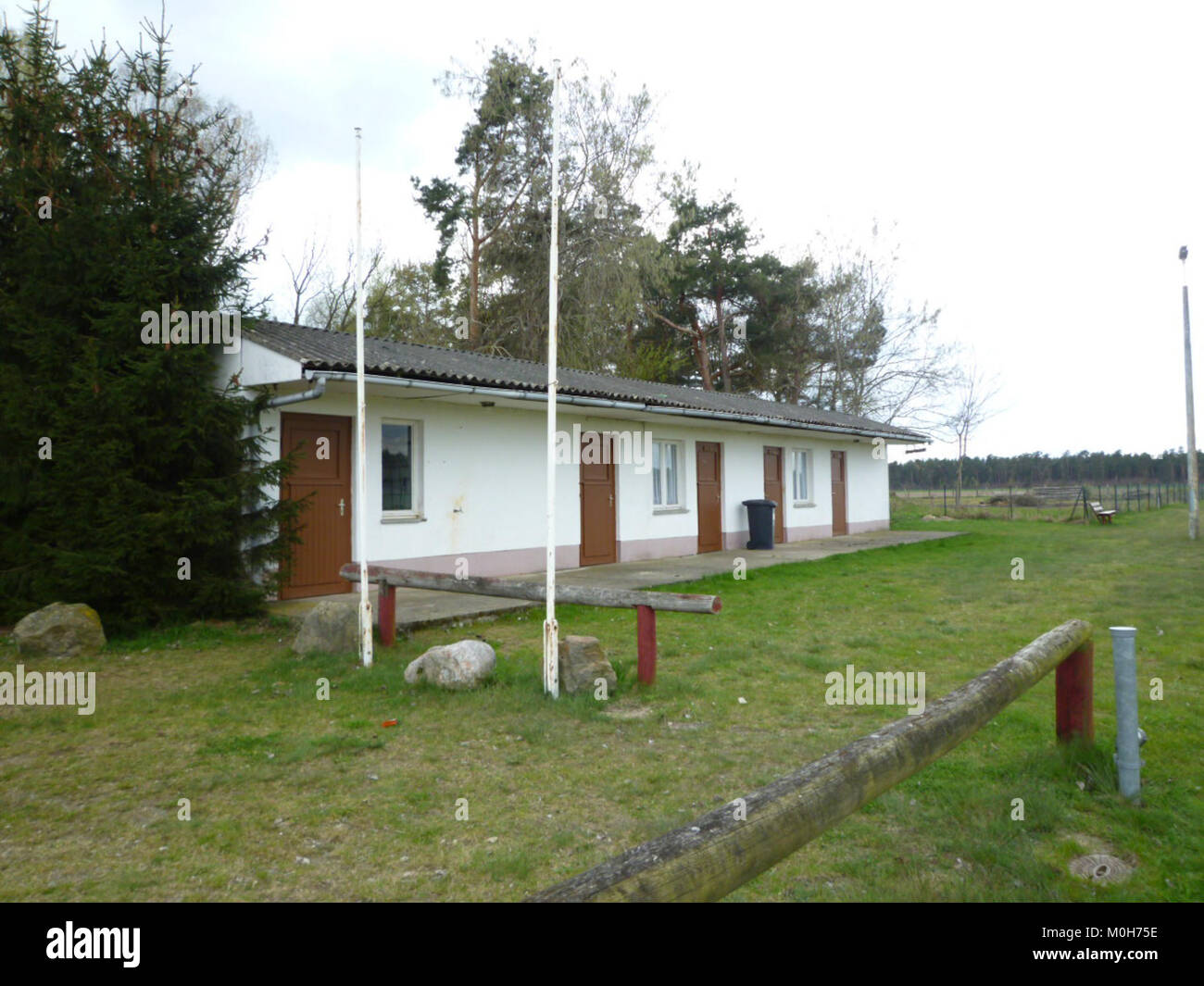 The image depicts the locker rooms and restrooms at the football field ...