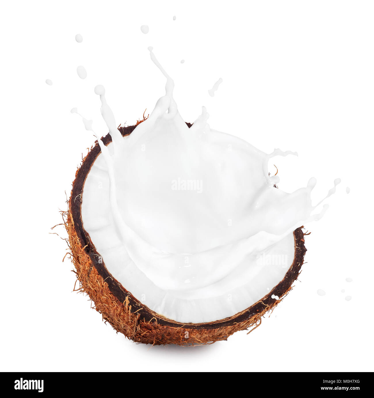 coconut with milk splash Stock Photo - Alamy