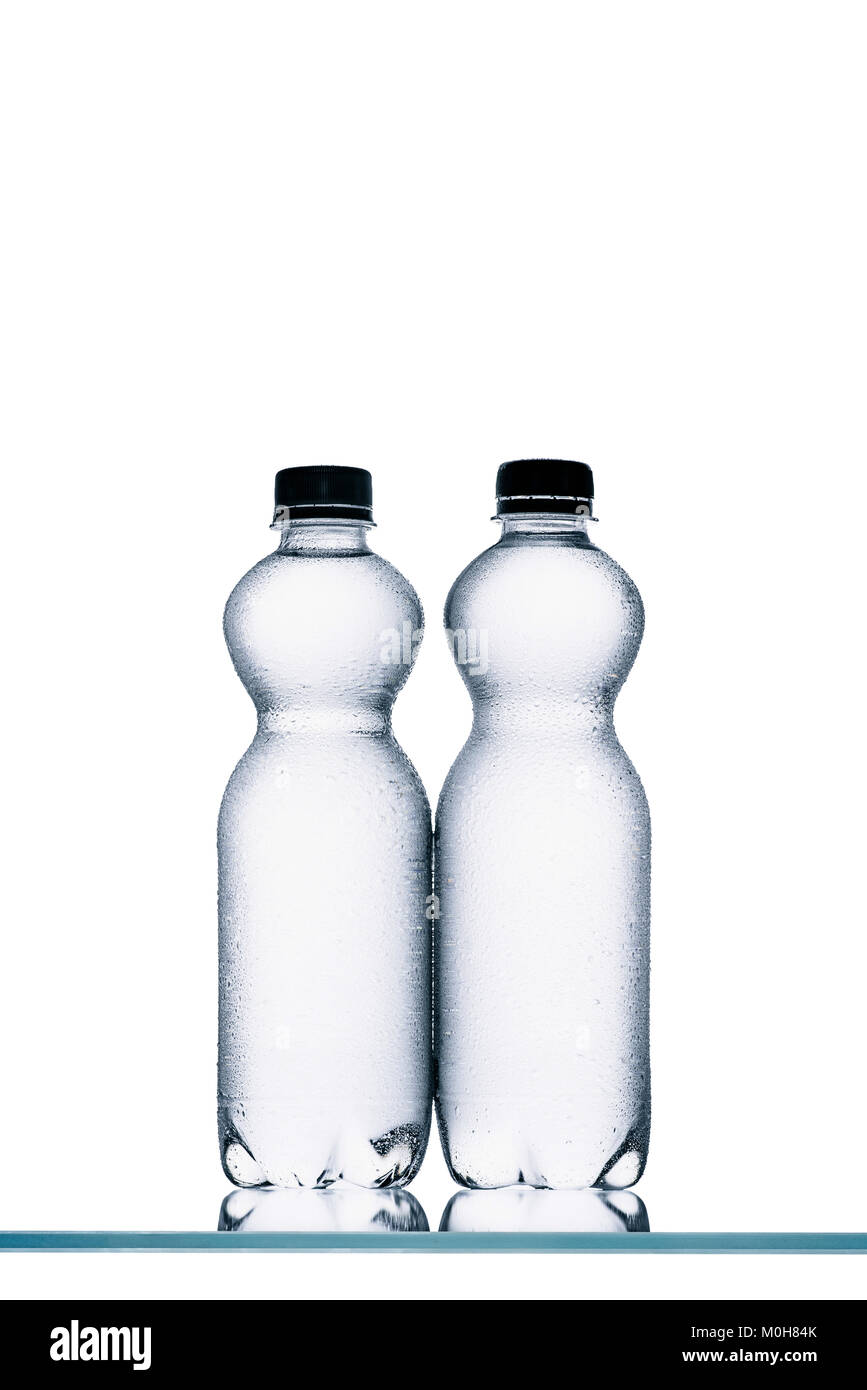wet plastic bottles of water isolated on white Stock Photo - Alamy