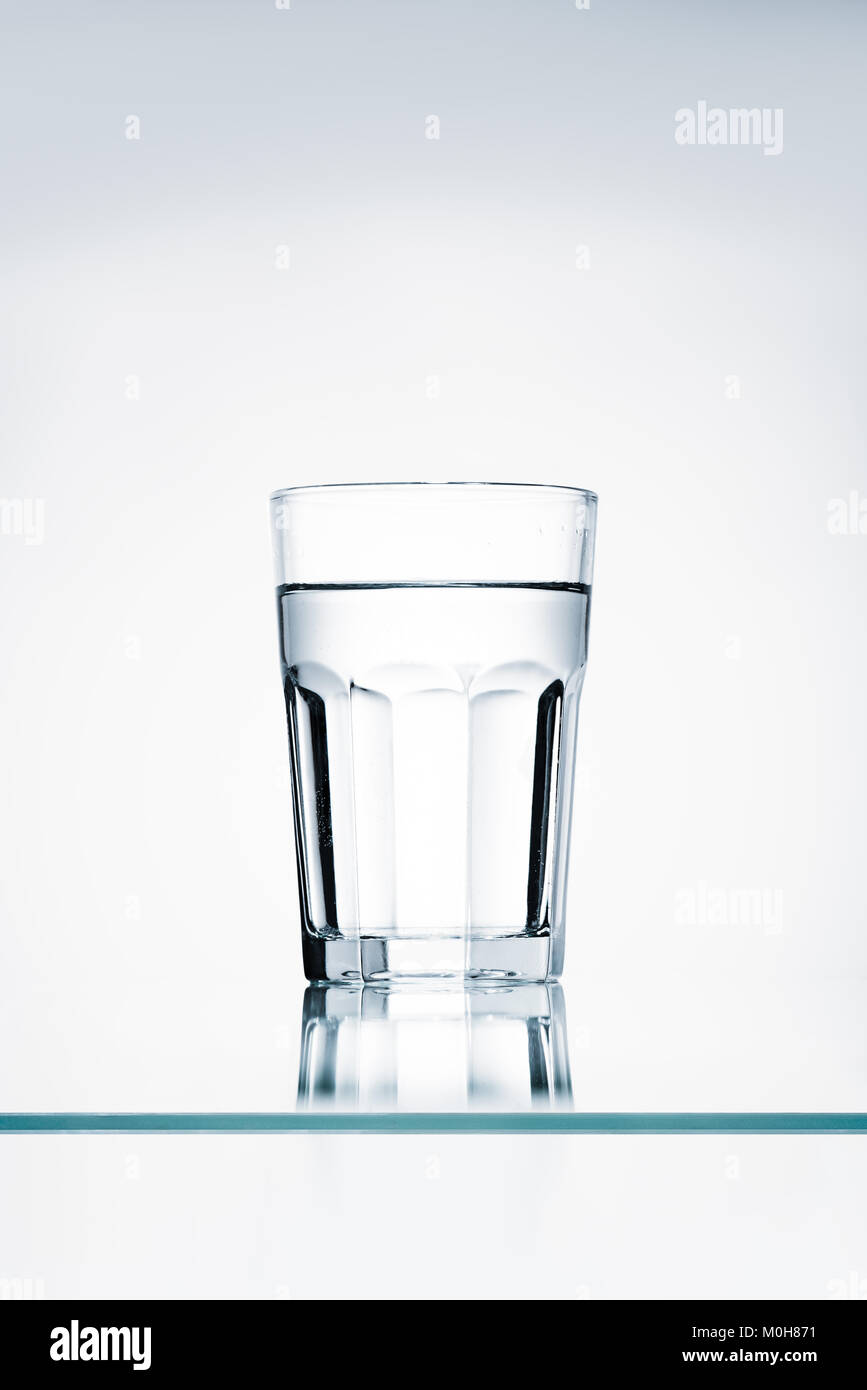 glass fn clear water on reflective surface Stock Photo - Alamy