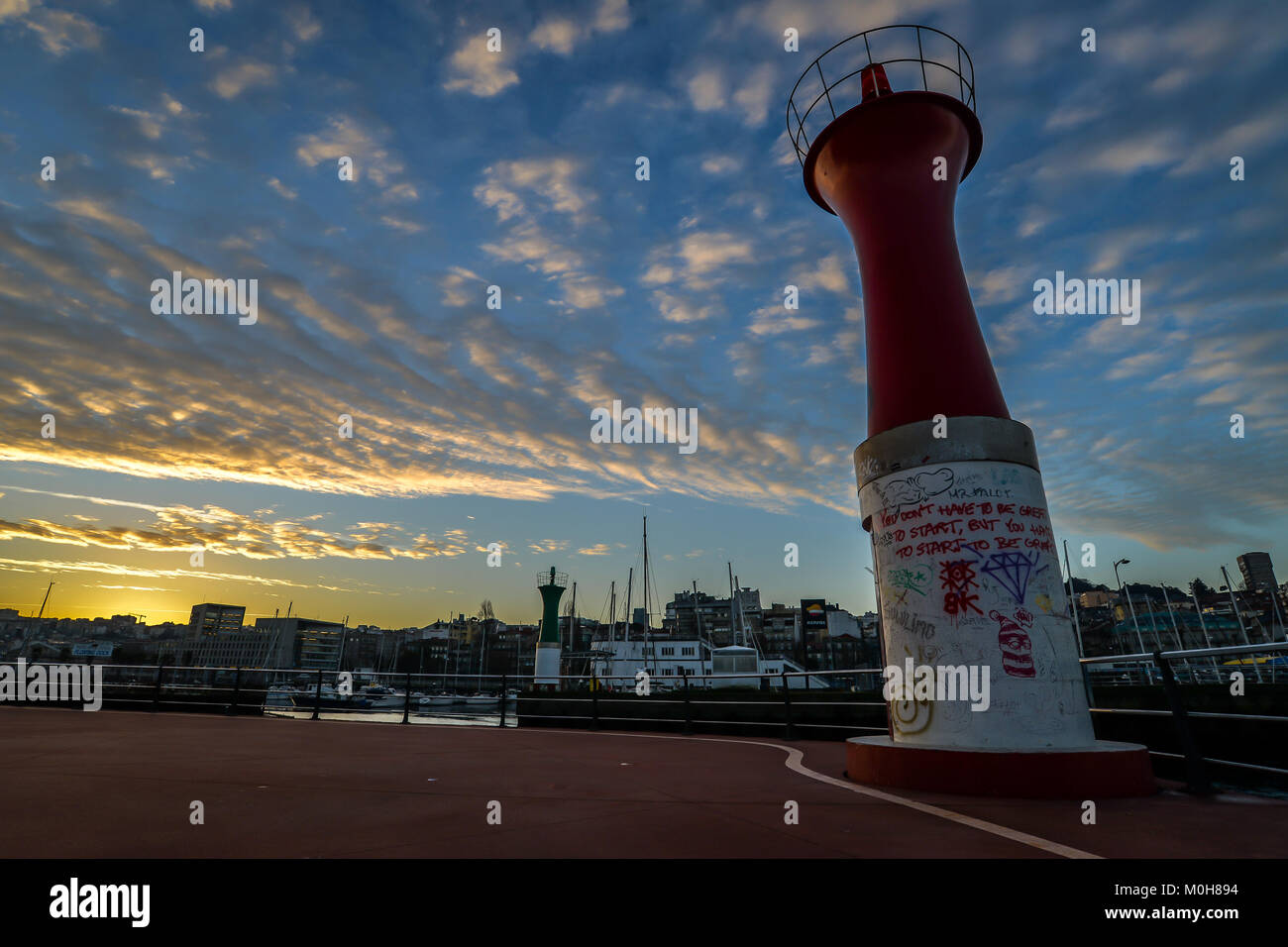 A small lighthouse at sunrise in Vigo Stock Photo - Alamy