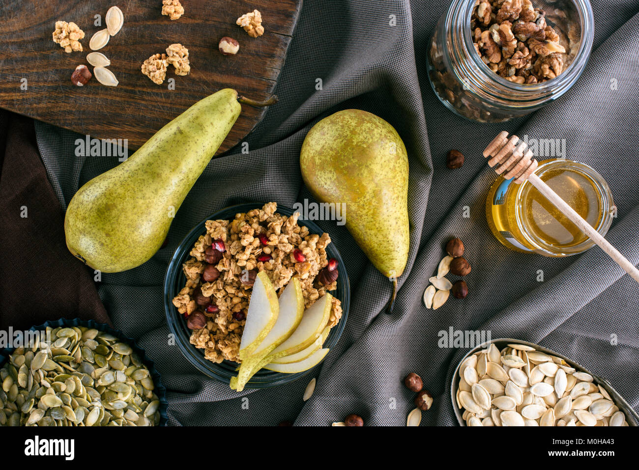 top view of pears, honey and homemade granola on tabletop Stock Photo ...