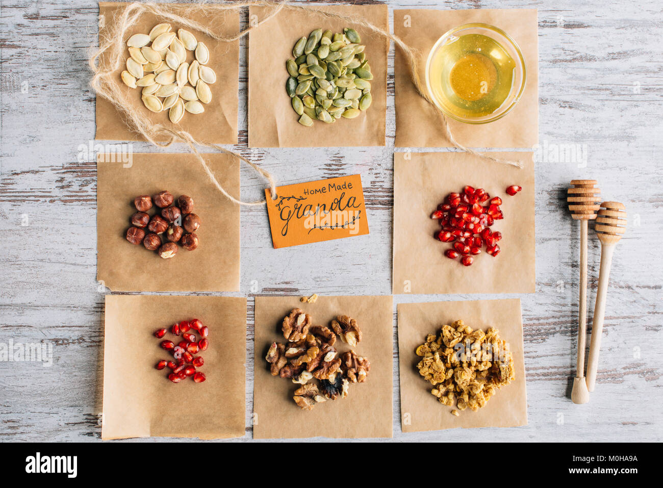 top view of granola ingredients with label on baking parchment pieces ...